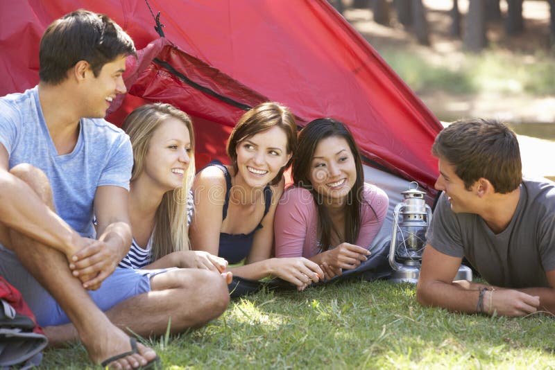 Group of Young People on Camping Holiday Together Stock Image - Image ...
