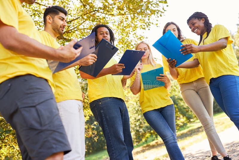 Group of Young People with Clipboard in Strategy Planning Stock Image ...