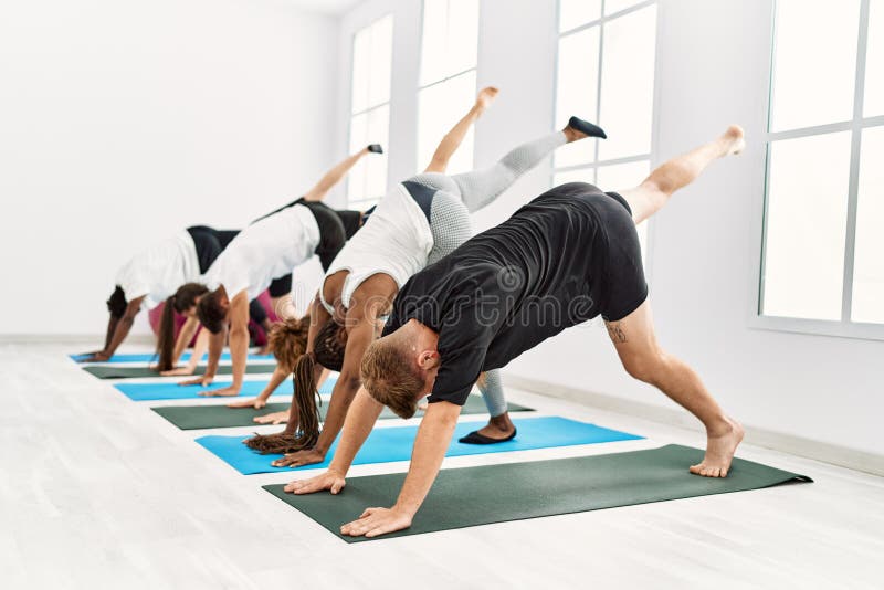 Group of Young People Concentrate Stretching at Sport Center Stock ...