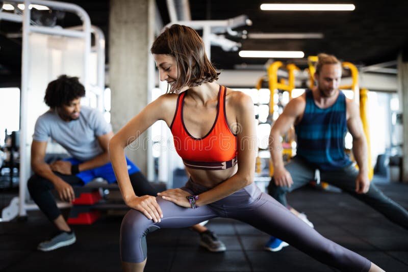 Group of Young People Doing Exercises in Gym Stock Image - Image of ...