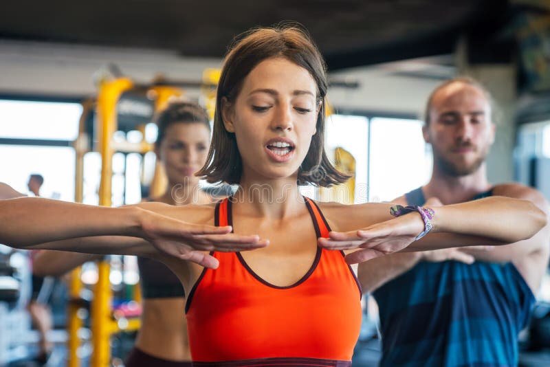 Group of Young People Doing Exercises in Gym Stock Image - Image of ...