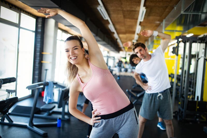 Group of Young People Doing Exercises in Gym Stock Image - Image of ...
