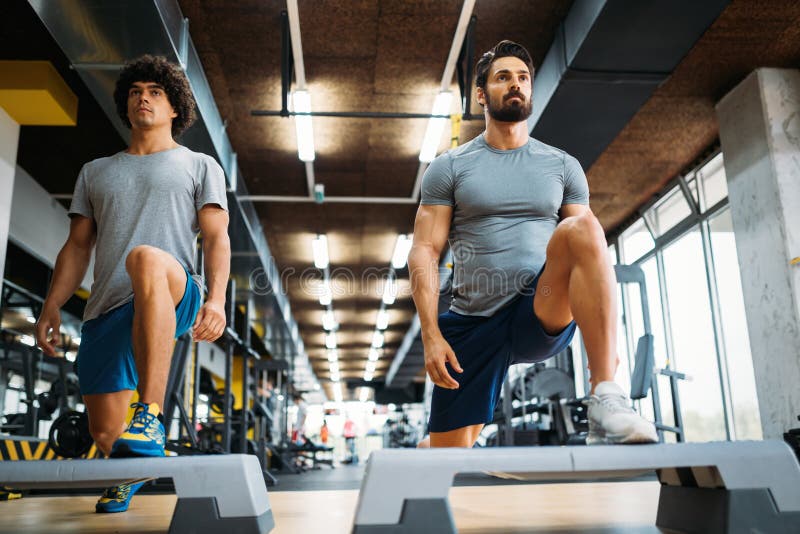 Group of Young People Doing Exercises in Gym Stock Photo - Image of ...