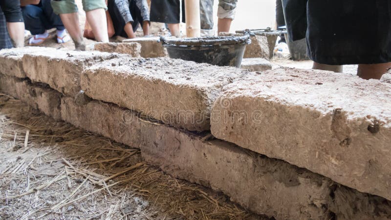 Group of Young People Earth Building the Wall of Earthen House Stock ...