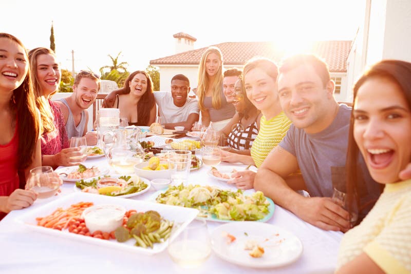 Group of Young People Enjoying Outdoor Summer Meal Stock Image - Image ...