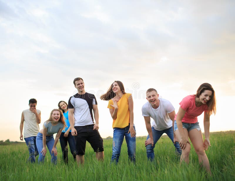 Group of Young People on the Field Stock Photo - Image of women ...