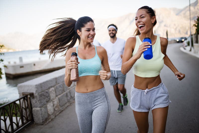 Group of Young People Friends Running Outdoors at Seaside Stock Photo ...