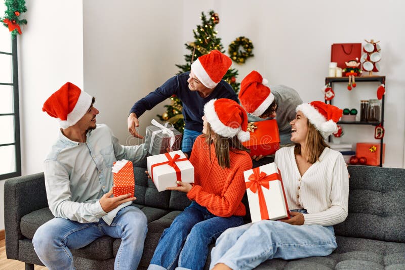 Group of Young People Giving Christmas Gift at Home Stock Photo - Image ...