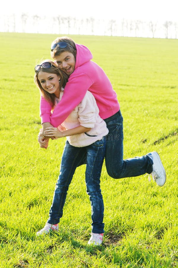 Group of Young People on a Green Field Stock Photo - Image of playful ...