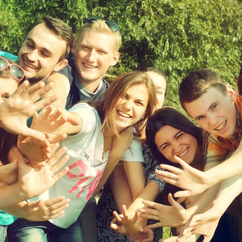 Group of Young People with Hands Together Smiling and Having Fun Stock ...