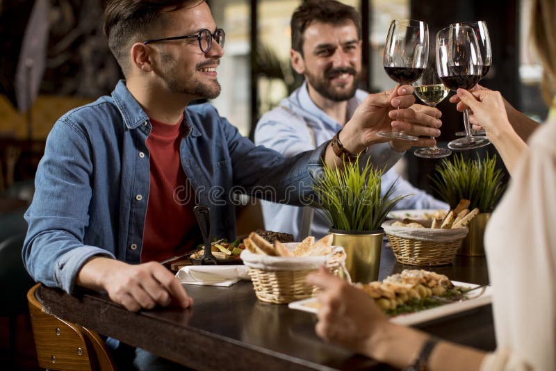 Group of Young People Having Dinner in the Restaurant Stock Image ...