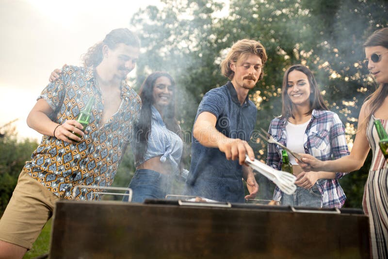 Group of Young People Having Fun with a Barbeque Stock Image - Image of ...