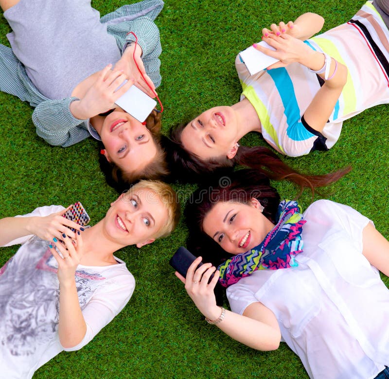 Group of Young People Having Fun in Grass Stock Photo - Image of ...