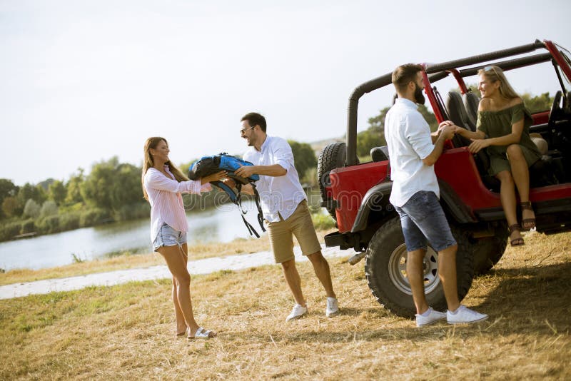 Group of Young People Having Fun on the River Bank Stock Image - Image ...