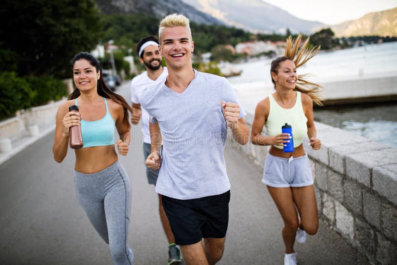 Group of Young People Jogging and Running Outdoors in Nature Stock ...