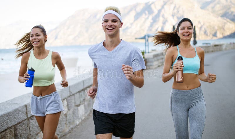 Group of Young People Jogging and Running Outdoors in Nature Stock ...