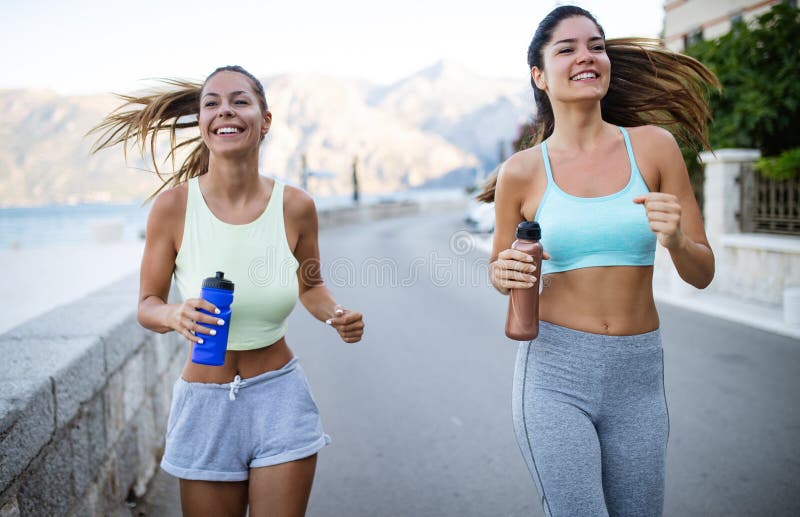 Group of Young People Jogging and Running Outdoors in Nature Stock ...