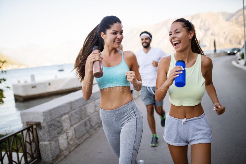 Group of Young People Jogging and Running Outdoors in Nature Stock ...