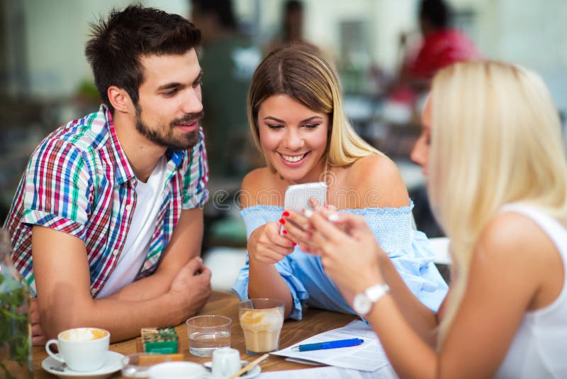 Group of Young People Laughing in Cafe Stock Image - Image of enjoyment, scene: 79986139