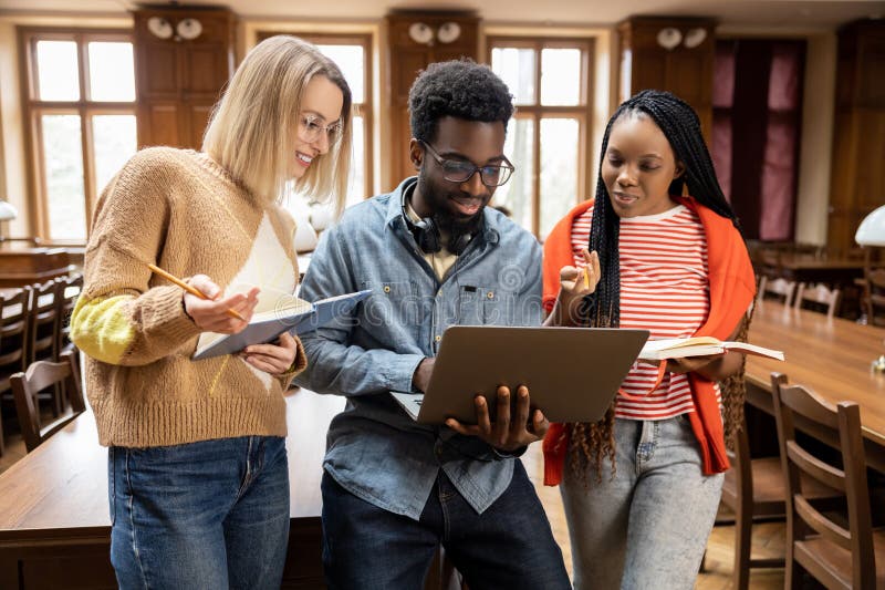 Group of Young People in the Library Looking Busy and Intersted Stock ...