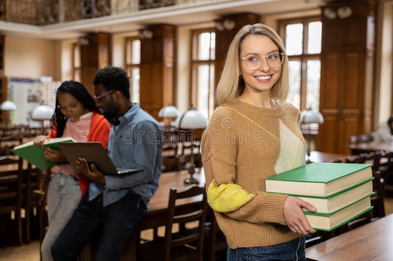 Group of Young People in the Library Looking Busy and Involved Stock ...