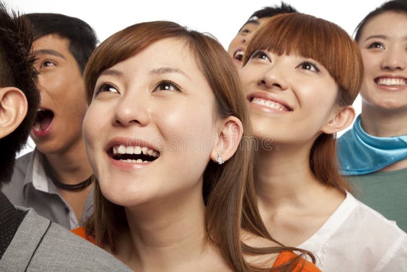 A Group of Young People Looking Up in Excitement Stock Photo - Image of ...