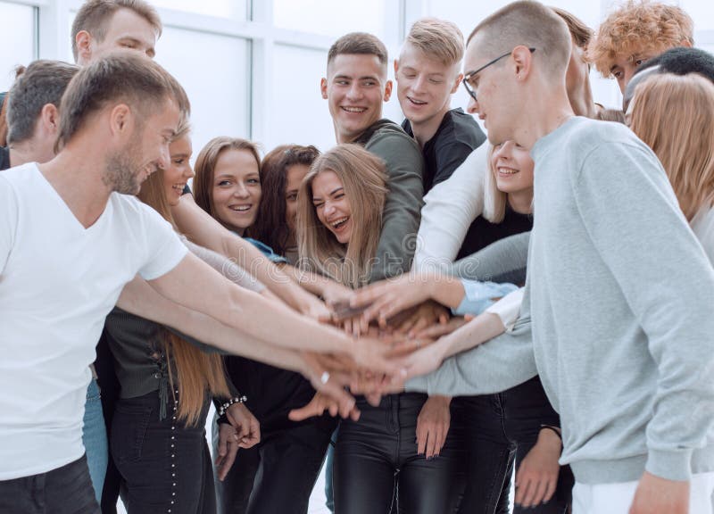 Group of Young People Making a Tower Out of Their Hands Stock Photo ...