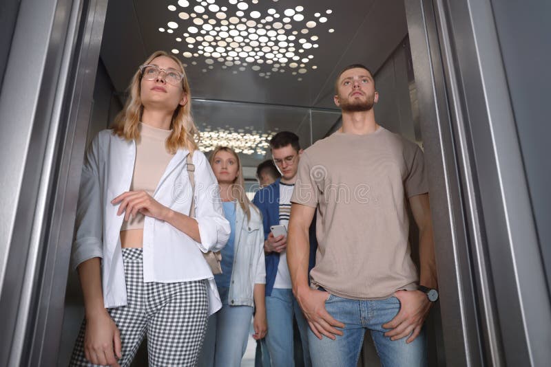 Group of Young People in Modern Elevator Stock Photo - Image of move, grey: 258102674