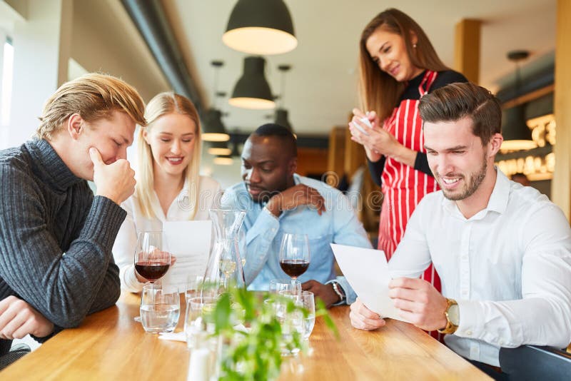Group of Young People when Ordering in the Restaurant Stock Photo ...