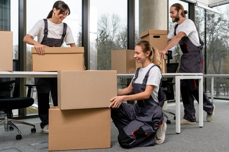 Group Young People Packing Boxes Looking Involved Stock Photos - Free ...