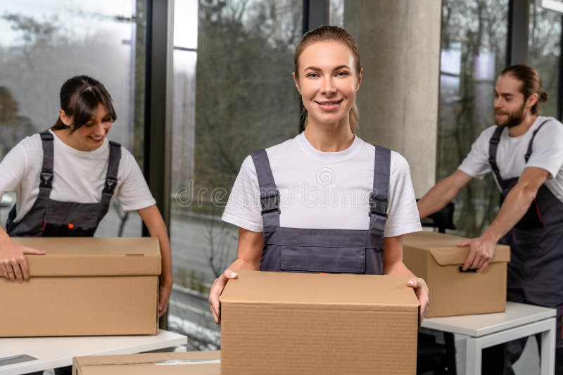 Group of Young People Packing the Boxes and Looking Involved Stock ...