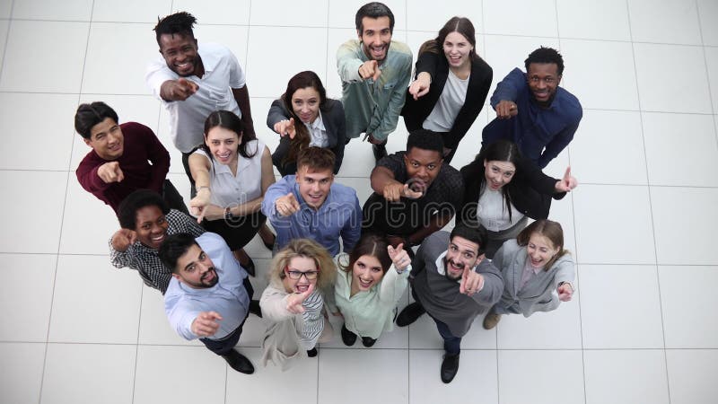 Large Team of Young People Pointing Somewhere Up Stock Video - Video of ...