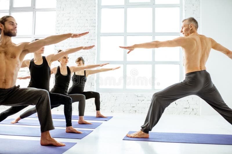 Group of People Practising Yoga Indoors Stock Photo - Image of activity ...