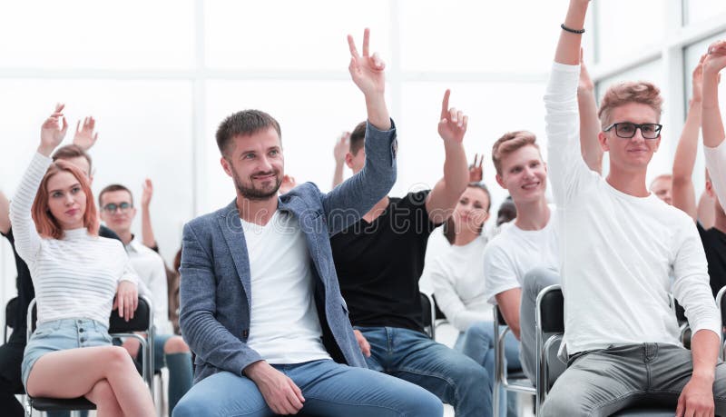 Group of Young People Raising Their Hands To Ask a Question. Stock ...