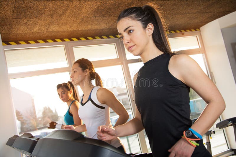 Group of Young People Running on Treadmill in Gym Stock Photo - Image ...