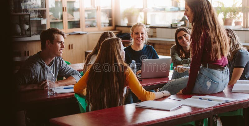 University Students Chatting during Break in Class Stock Photo - Image ...