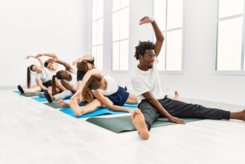 Group of Young People Smiling Happy Stretching at Sport Center Stock ...