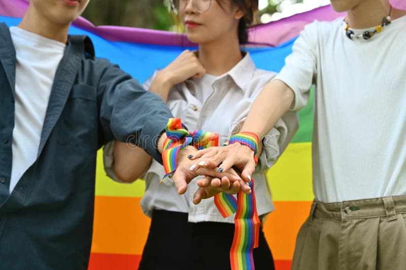 Group of Young People Stacking Hands Together, Showing Freedom and ...
