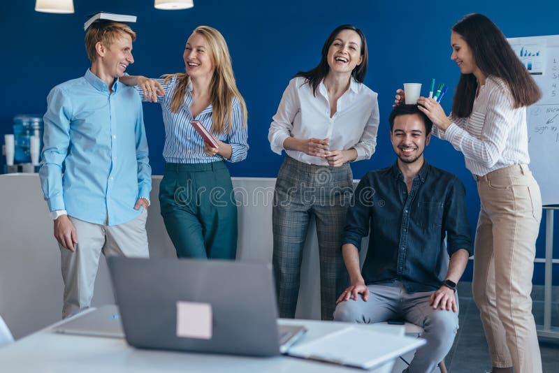 Group of Young People Standing in Class during Recess and Laughing ...