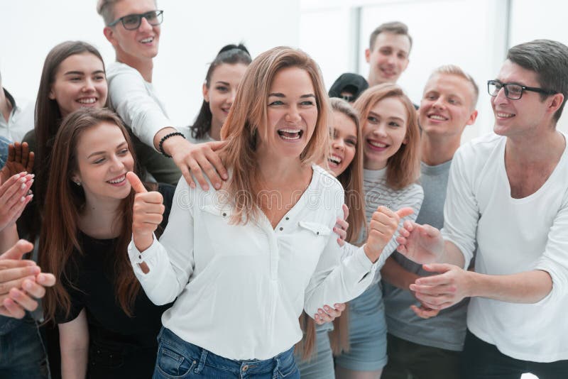 Group of Young People Supporting Their Happy Leader Stock Image - Image ...