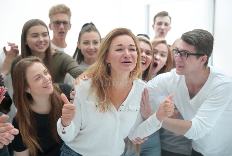 Group of Young People Supporting Their Happy Leader Stock Image - Image ...