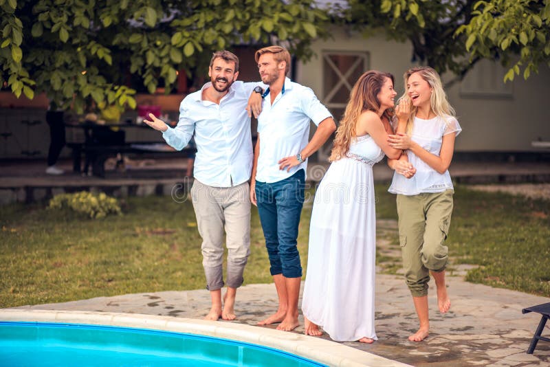 Group of Young People by Swimming Pool. Stock Image - Image of middle ...