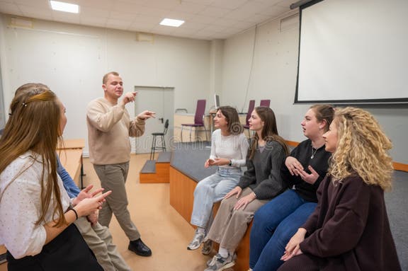 A Group of Young People Talking in Sign Language. Stock Image - Image ...