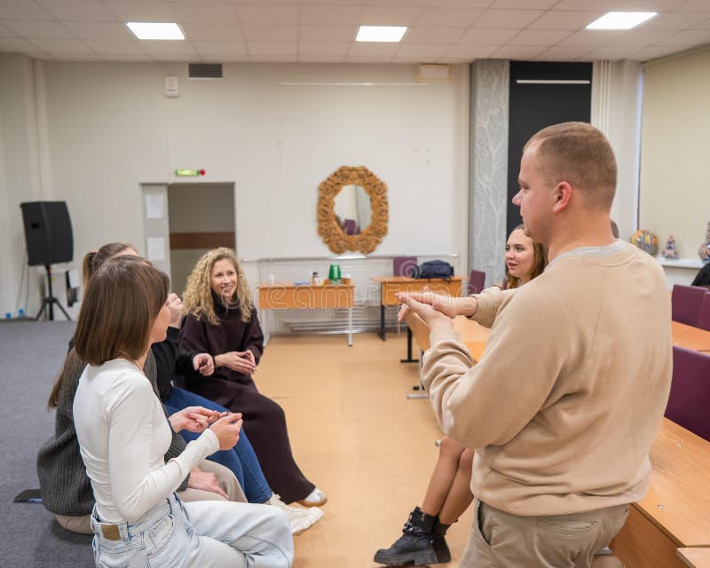 A Group of Young People Talking in Sign Language. Stock Photo - Image ...