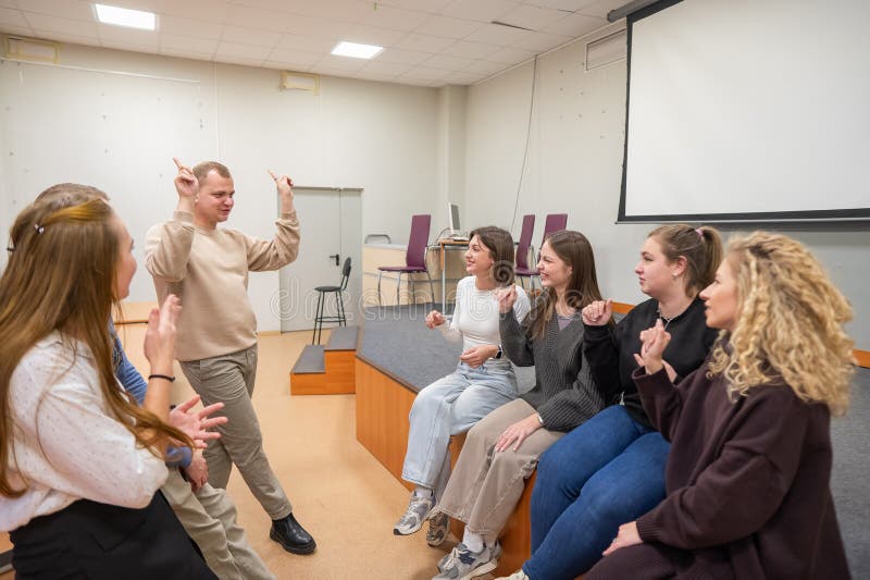 A Group of Young People Talking in Sign Language. Stock Photo - Image ...