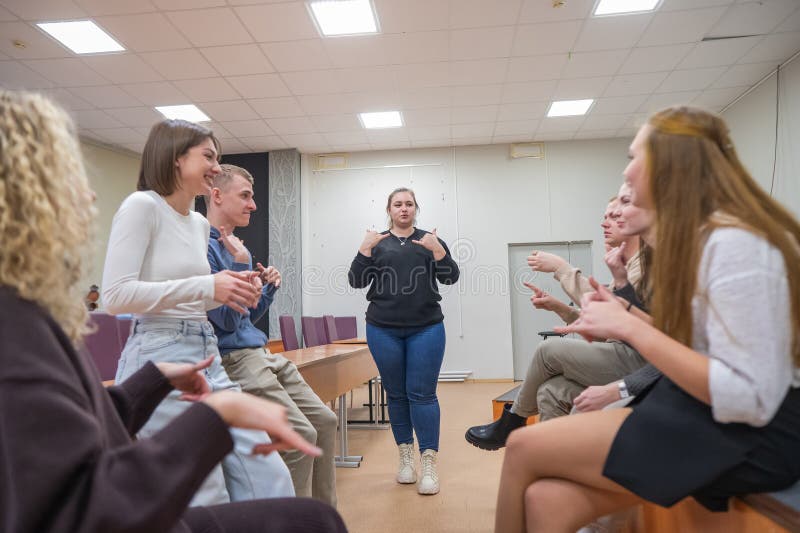 A Group of Young People Talking in Sign Language. Stock Photo - Image ...