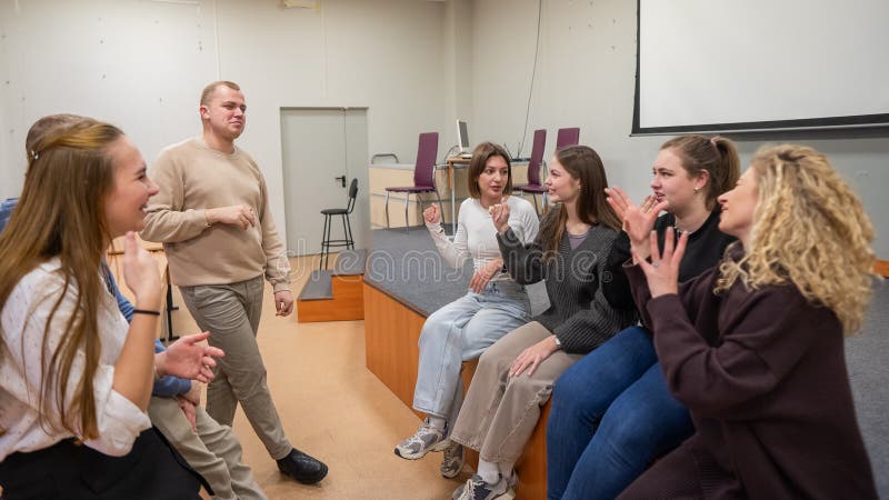A Group of Young People Talking in Sign Language. Stock Photo - Image ...