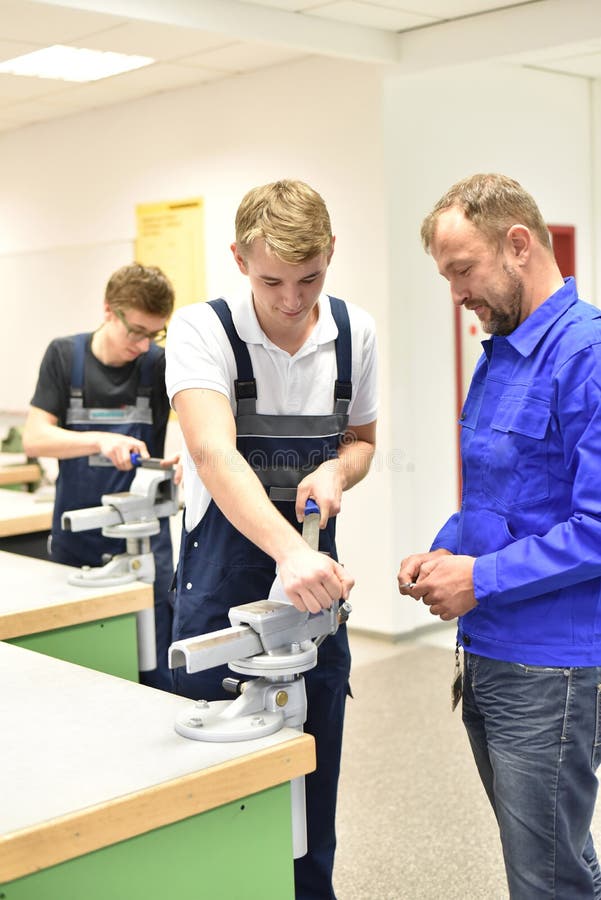 Group of Young People in Technical Vocational Training with Teacher ...