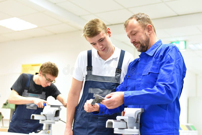Group of Young People in Technical Vocational Training with Teacher ...