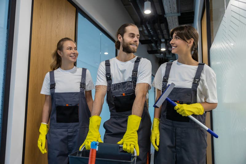 Group of Young People in Uniform Going To Clean the Office Stock Image ...